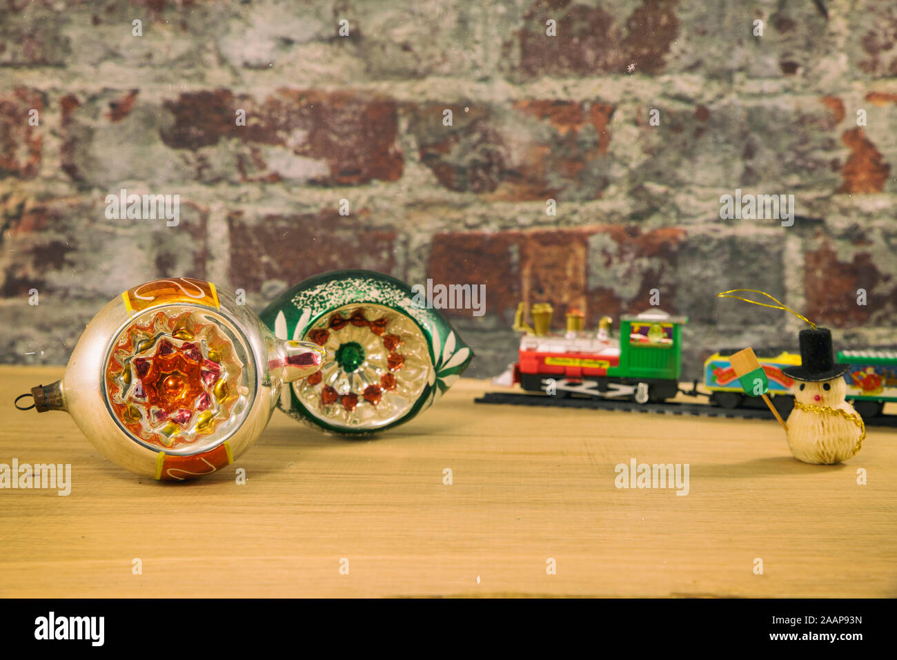 old christmas baubles with train and stone background Stock Photo - Alamy
