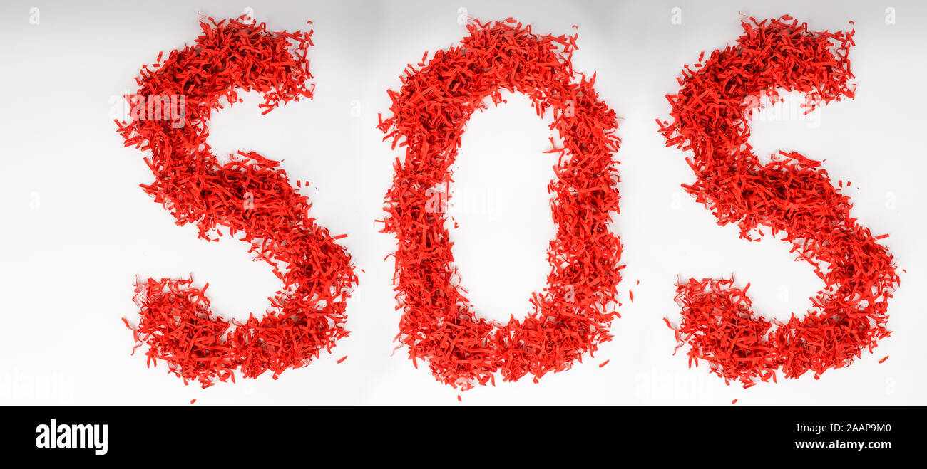 word sos from shredded paper concept of economical use of resources ...