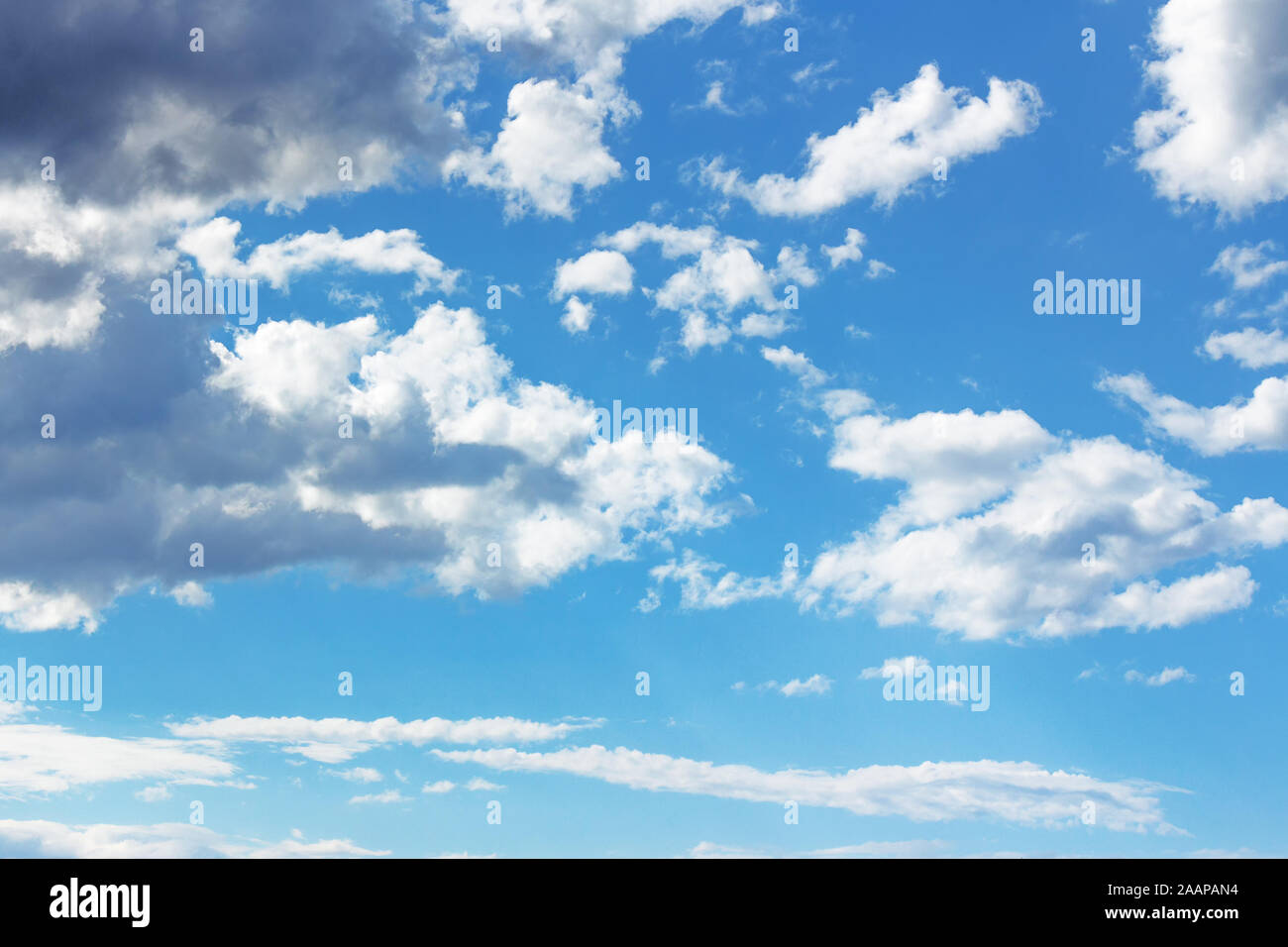 blue sky with clouds on a sunny april day. dynamic formations in windy ...