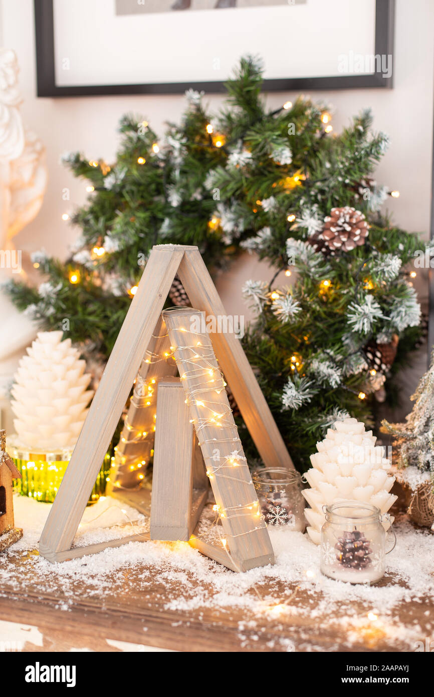 Pyramid made of wood and a few cones stand on the chest of drawers in ...