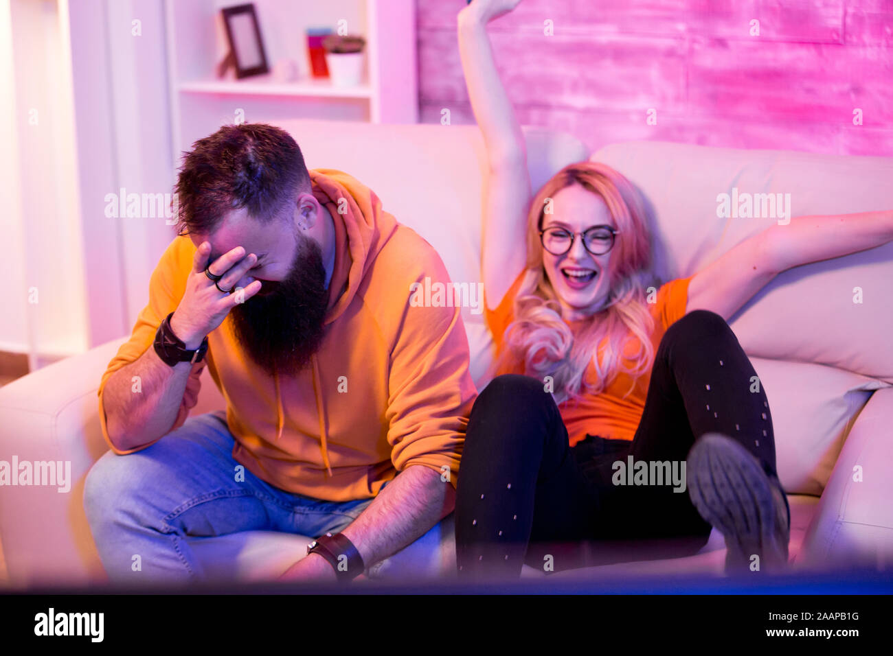 Blond girlfriend happy to win against her boyfriend on video games ...