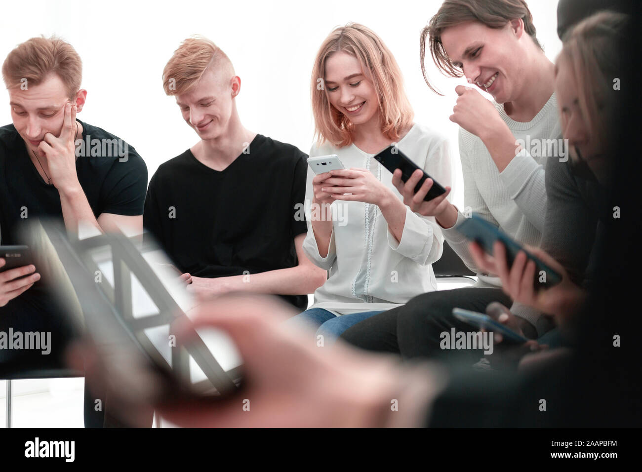 close up. casual guy looking at the screen of his smartphone Stock ...