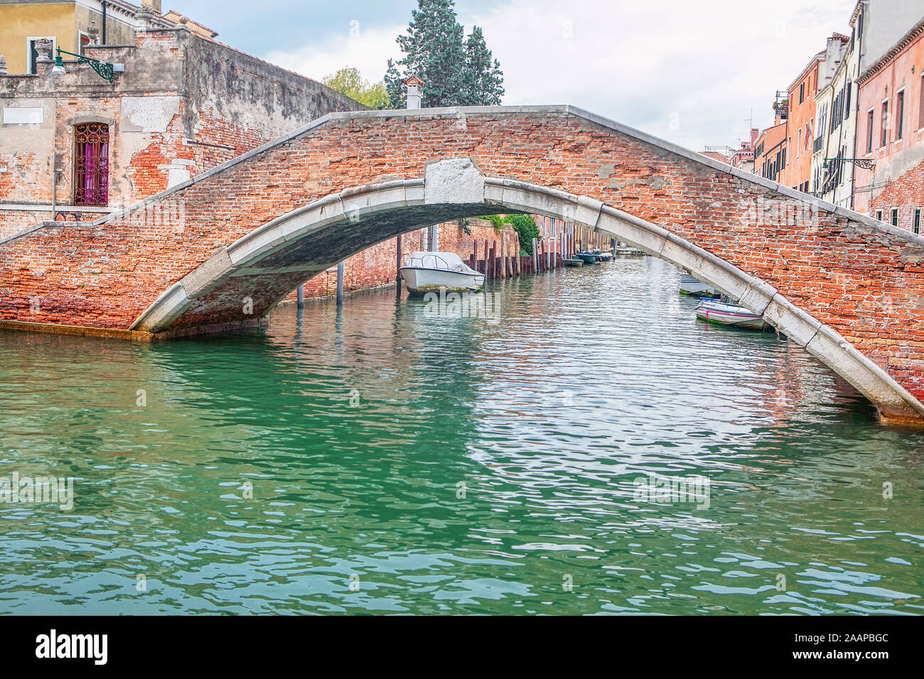 old red bricks bridge and water canal in Venice Stock Photo - Alamy