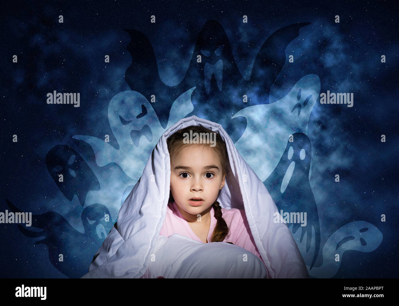 Scared girl with pillow hiding under blanket Stock Photo - Alamy