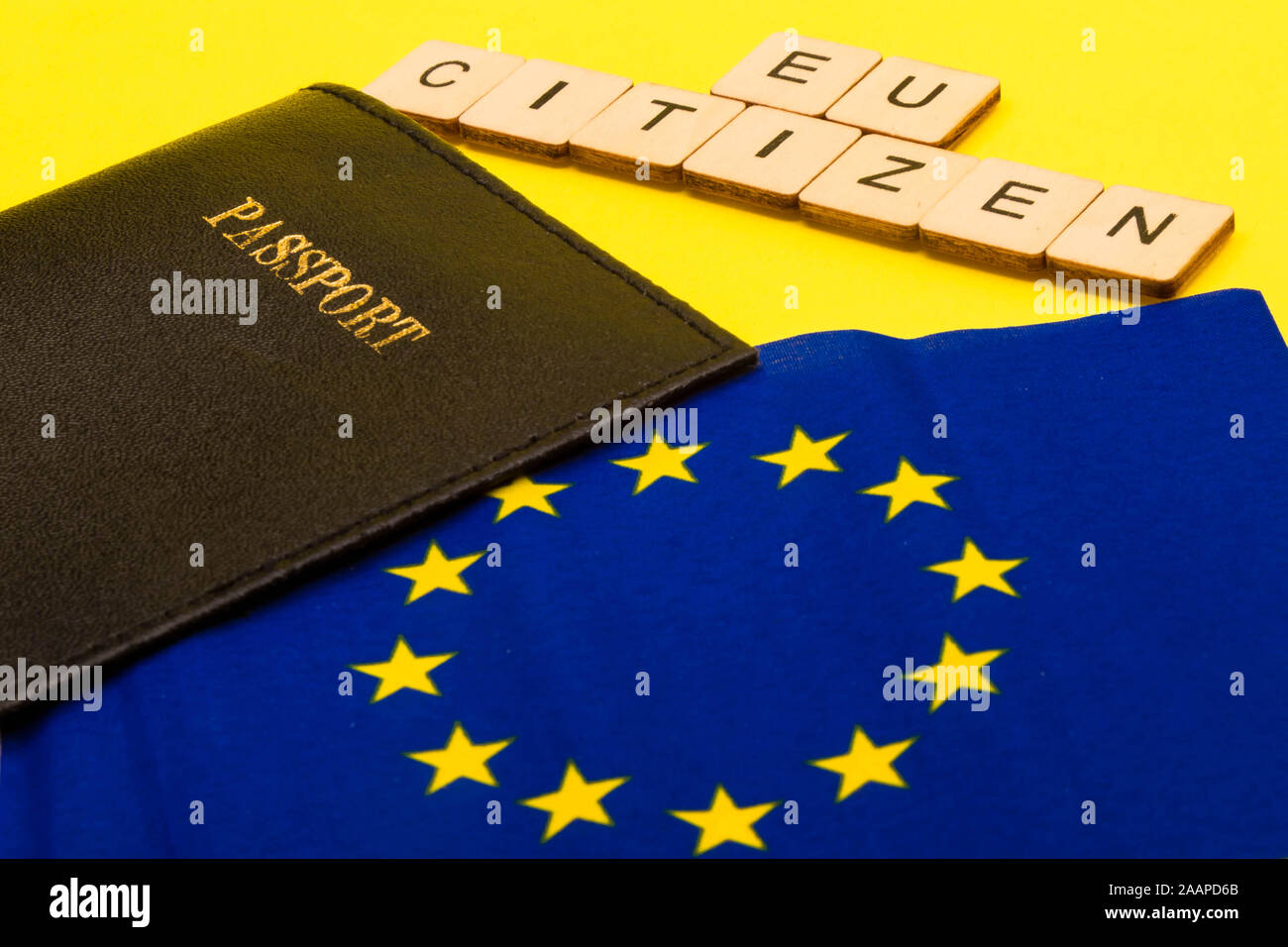 European union concept showing the flag of the EU and a passport on a ...