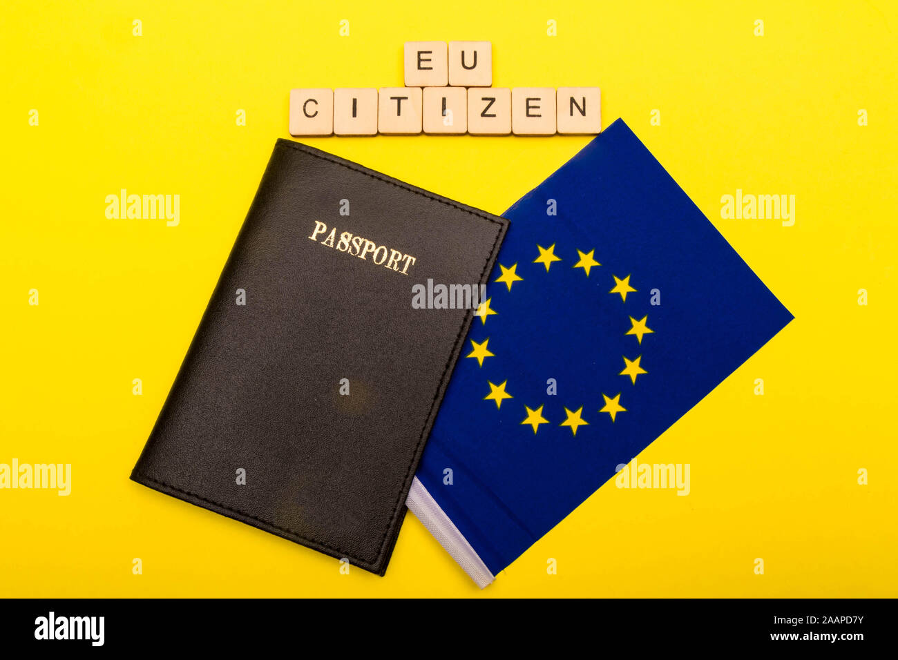 European union concept showing the flag of the EU and a passport on a ...