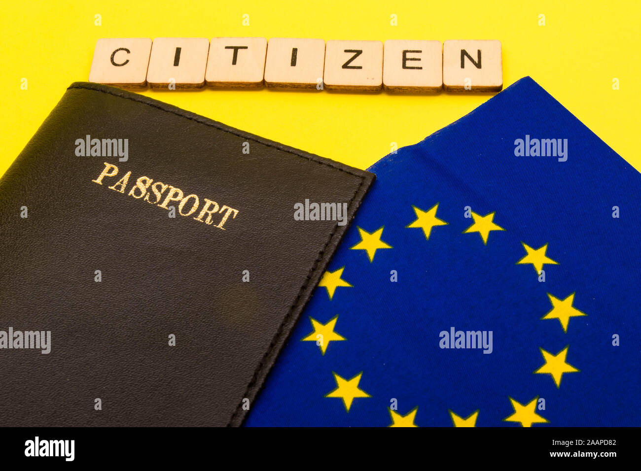 European union concept showing the flag of the EU and a passport on a ...