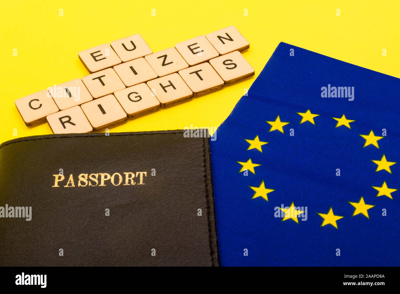 European union concept showing the flag of the EU and a passport on a ...