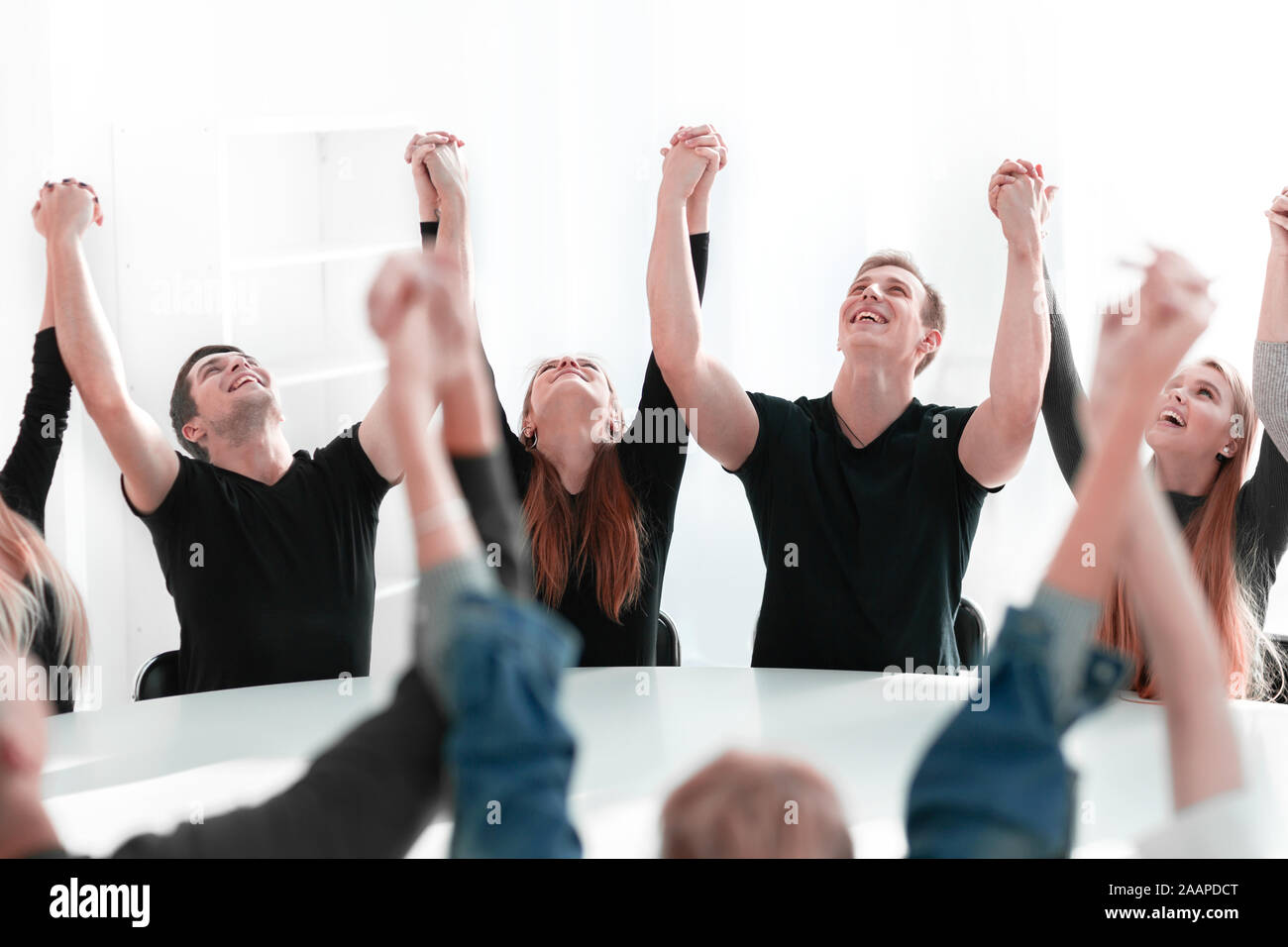 close up. a team of young people showing their unity Stock Photo - Alamy