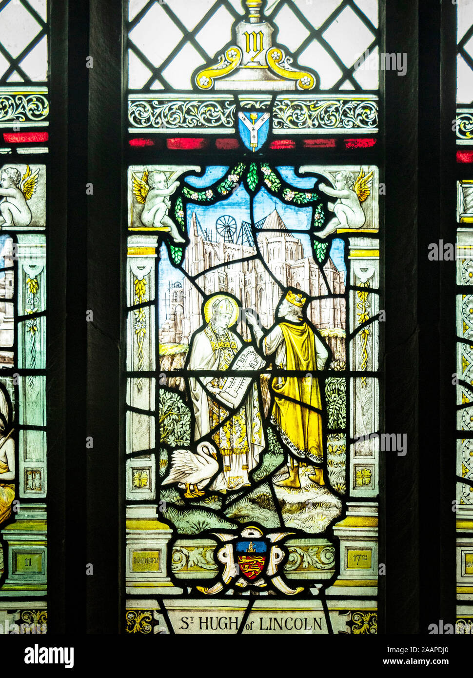 close up of old stained glass in the cloister of chester cathedral ...