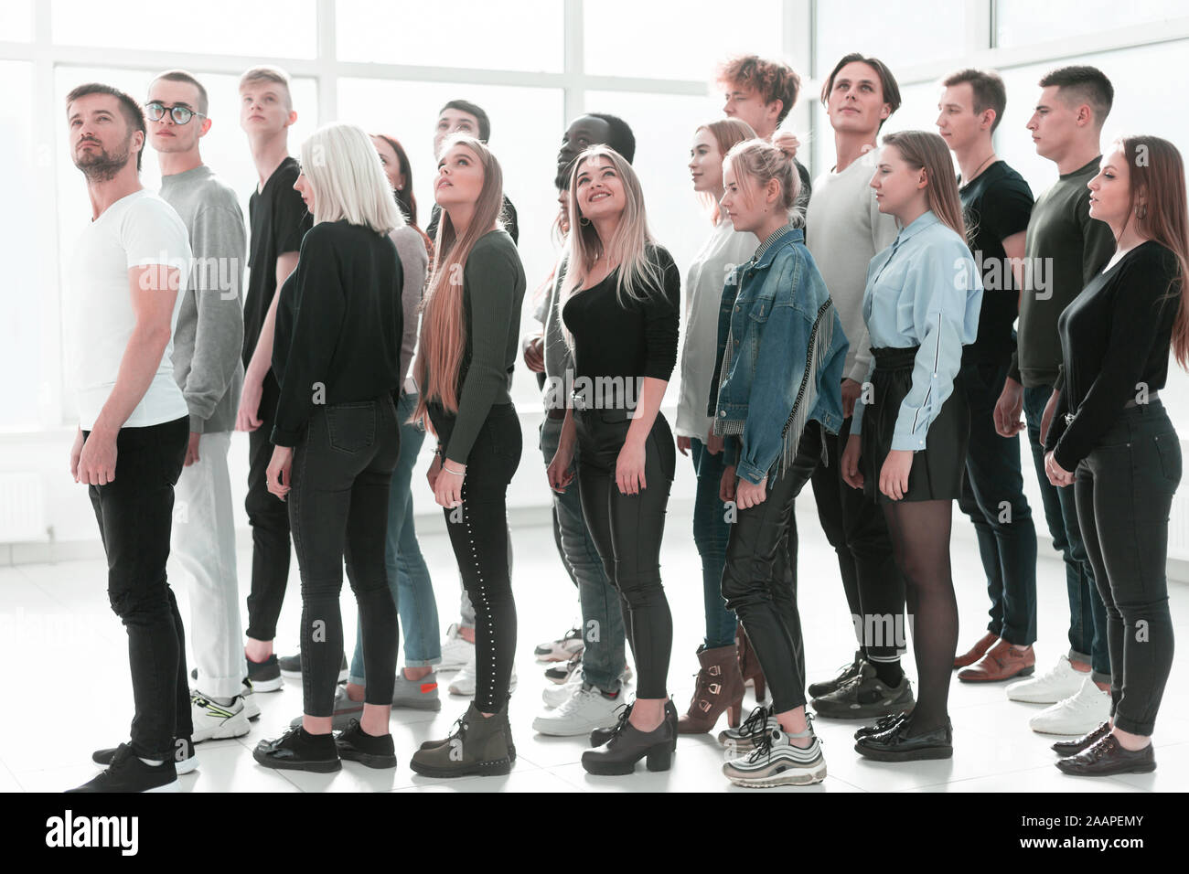 organized group of casual young people standing in a column Stock Photo ...