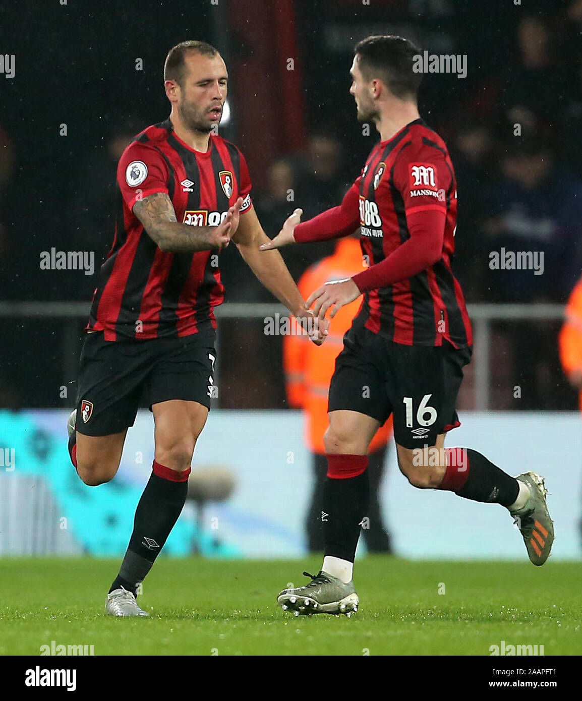 Bournemouth's Steve Cook (left) celebrates scoring his side's first ...