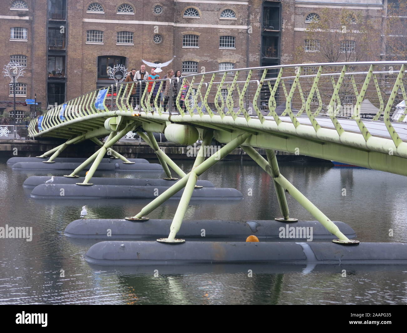 The floating pedestrian bridge at West India Quay, Canary Wharf, is a ...