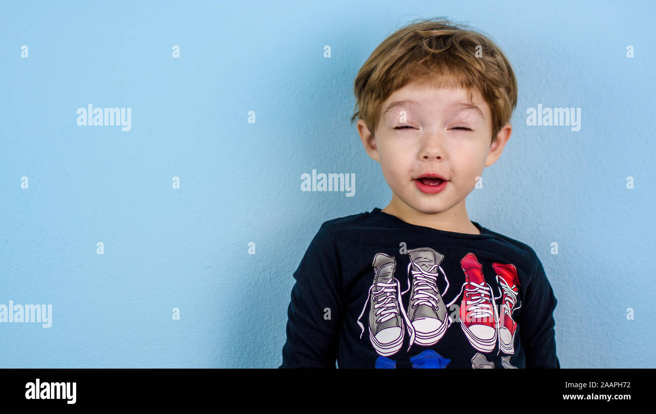 adorable small caucasian three years old boy with cute face expression ...