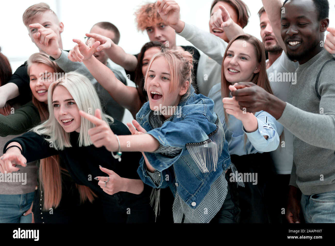 close up. a group of young people pointing at one point Stock Photo - Alamy
