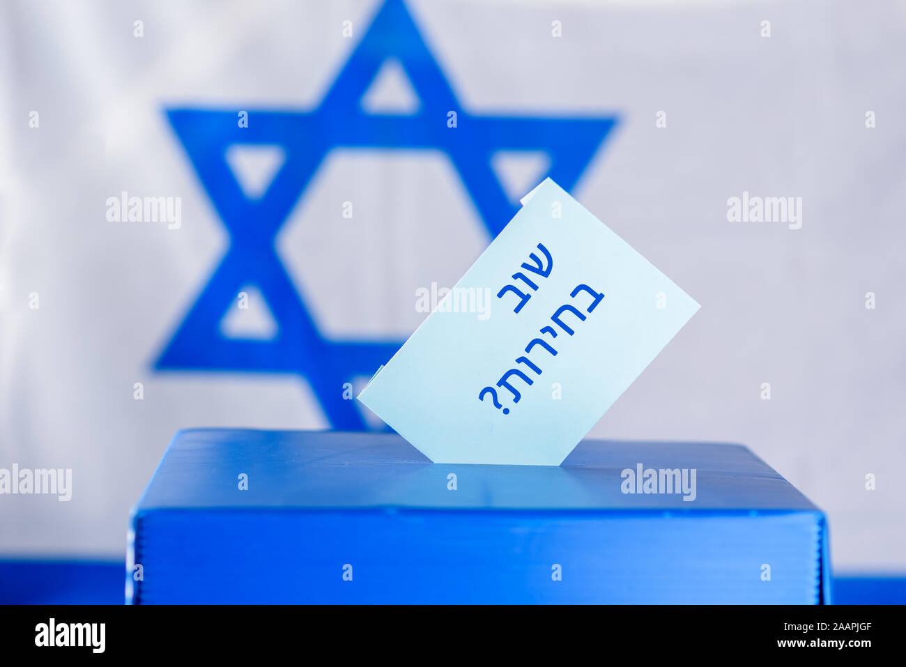 Vote box. Hebrew text elections again on voting paper over Israel flag ...