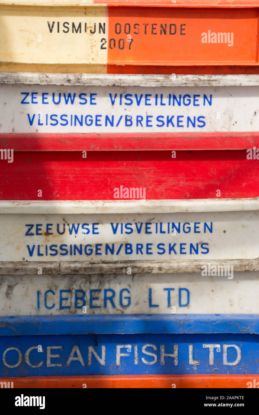 A stack of fish boxes on a quayside. Brigham England UK GB Stock Photo ...
