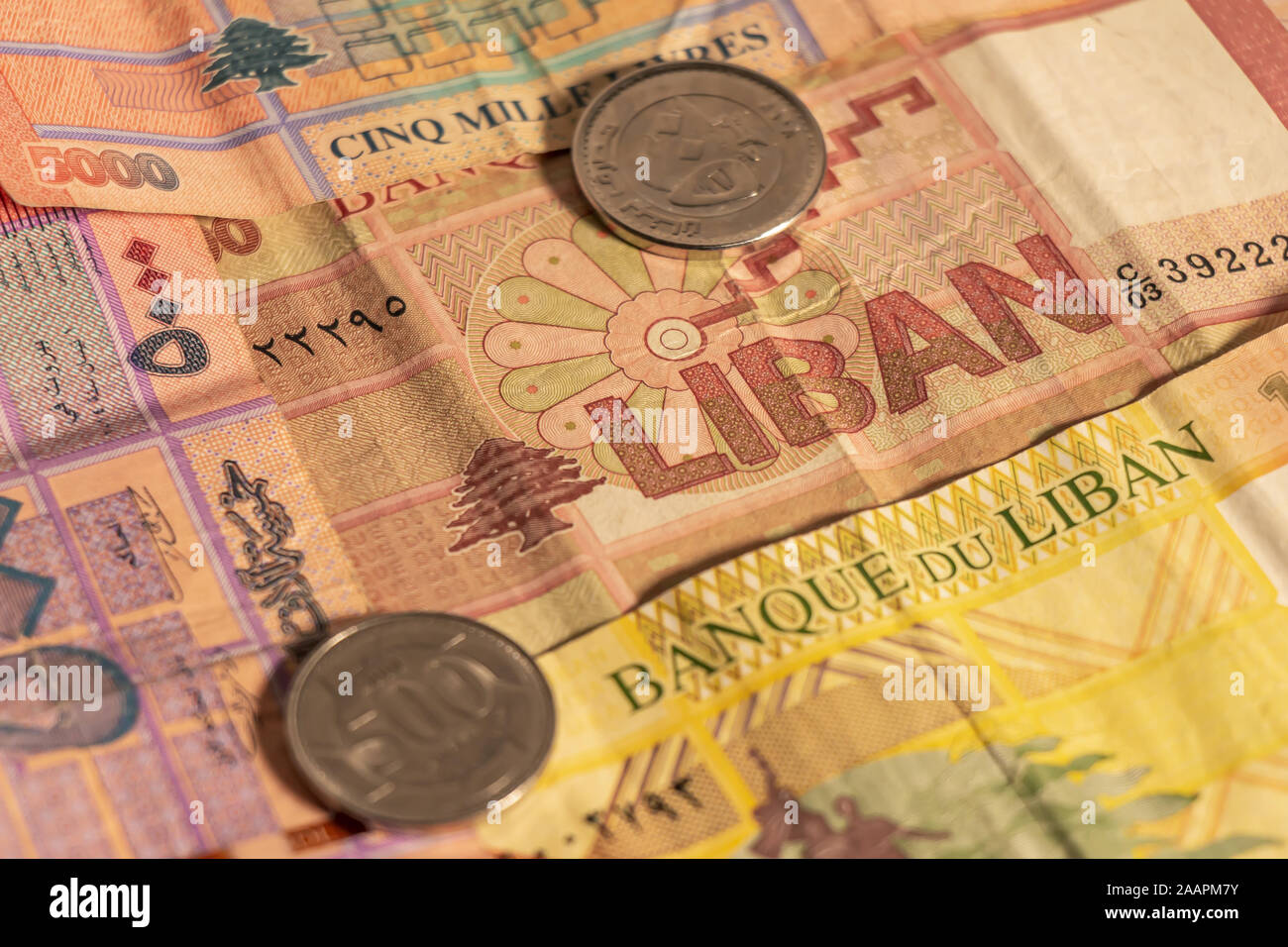 A composition of Lebanese lira LL. Lebanese pound LBP banknotes and ...
