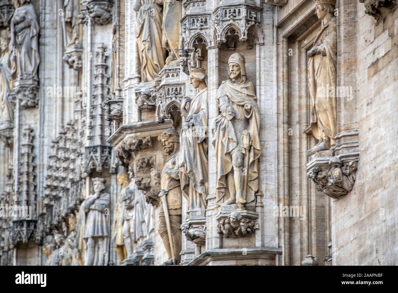 Gothic style statues on the facade of buildings in the Grand Place ...