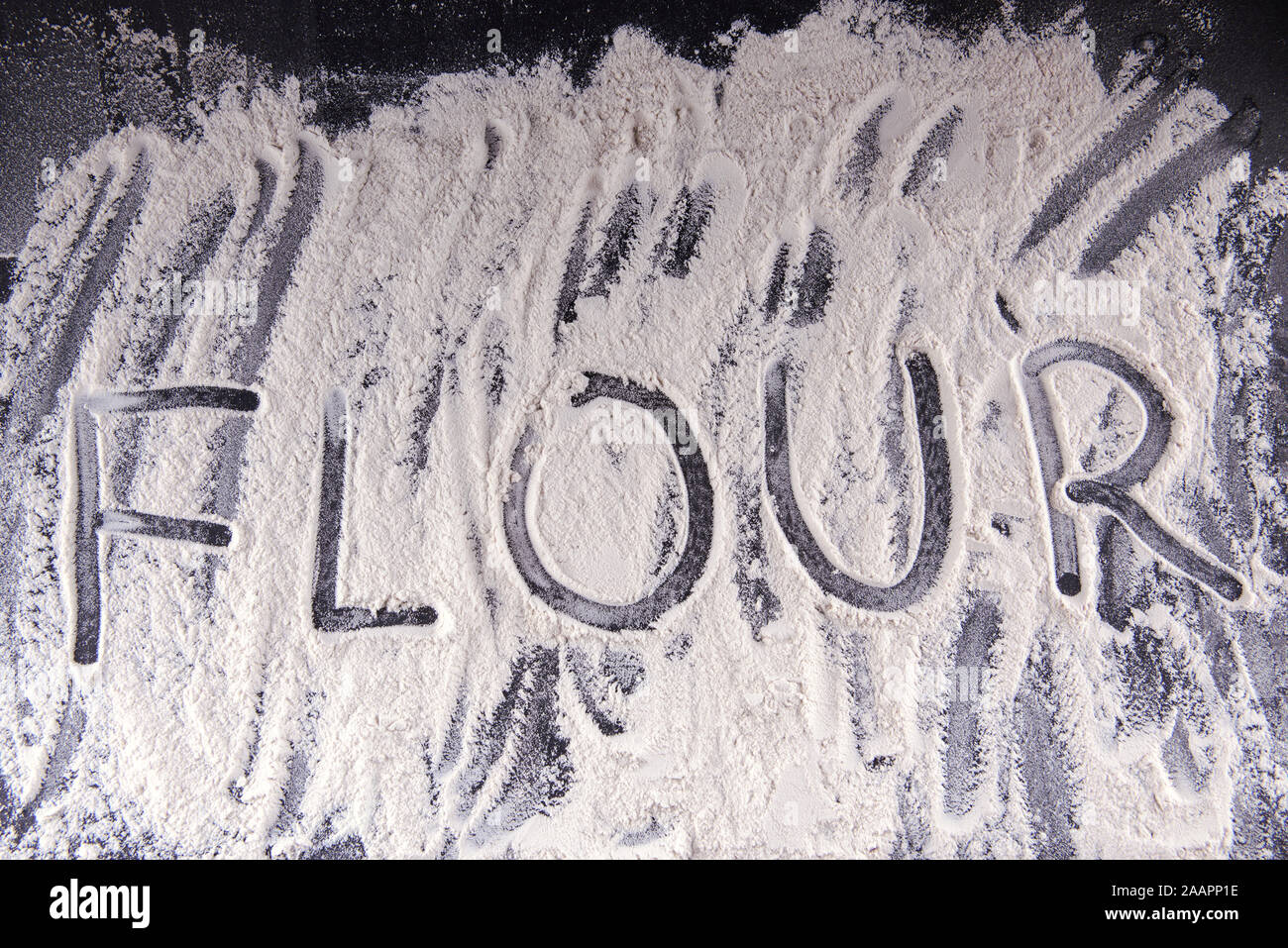 Word food written with flour on black background Stock Photo - Alamy