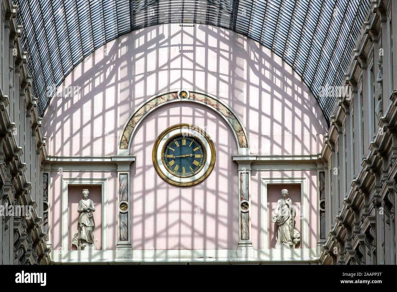 A grid of shadows covers a clock and statues, Brussels, Belgium Stock ...