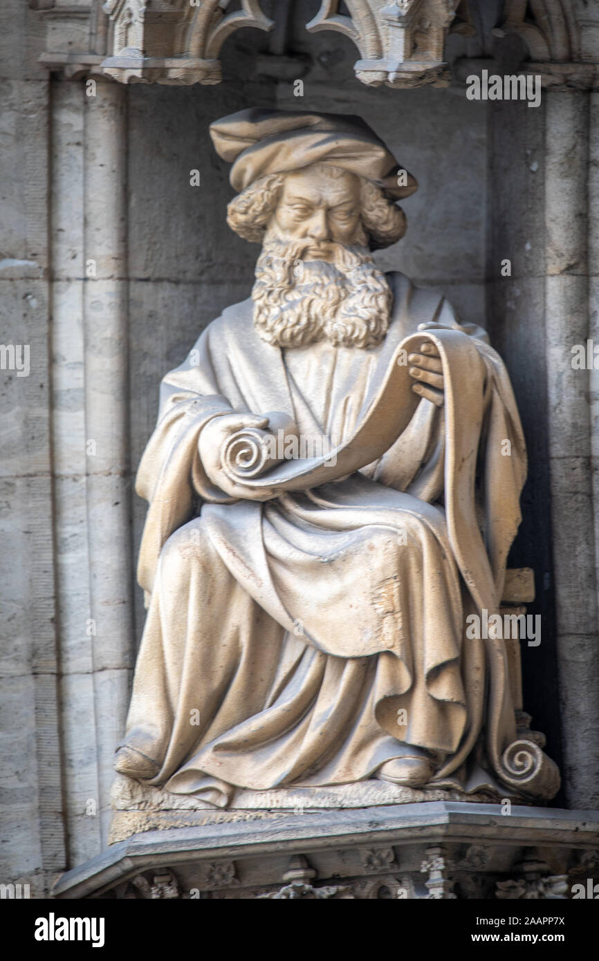 A sculpture of a scholar reviewing a scroll, Brussels, Belgium Stock ...
