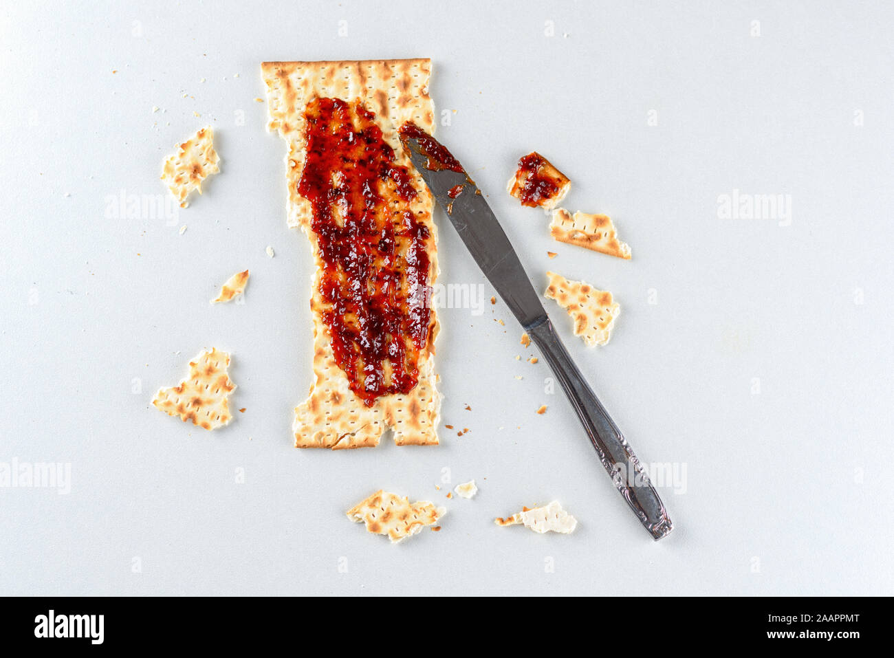 Pesach celebration concept. Matzah and jam on white table, background ...