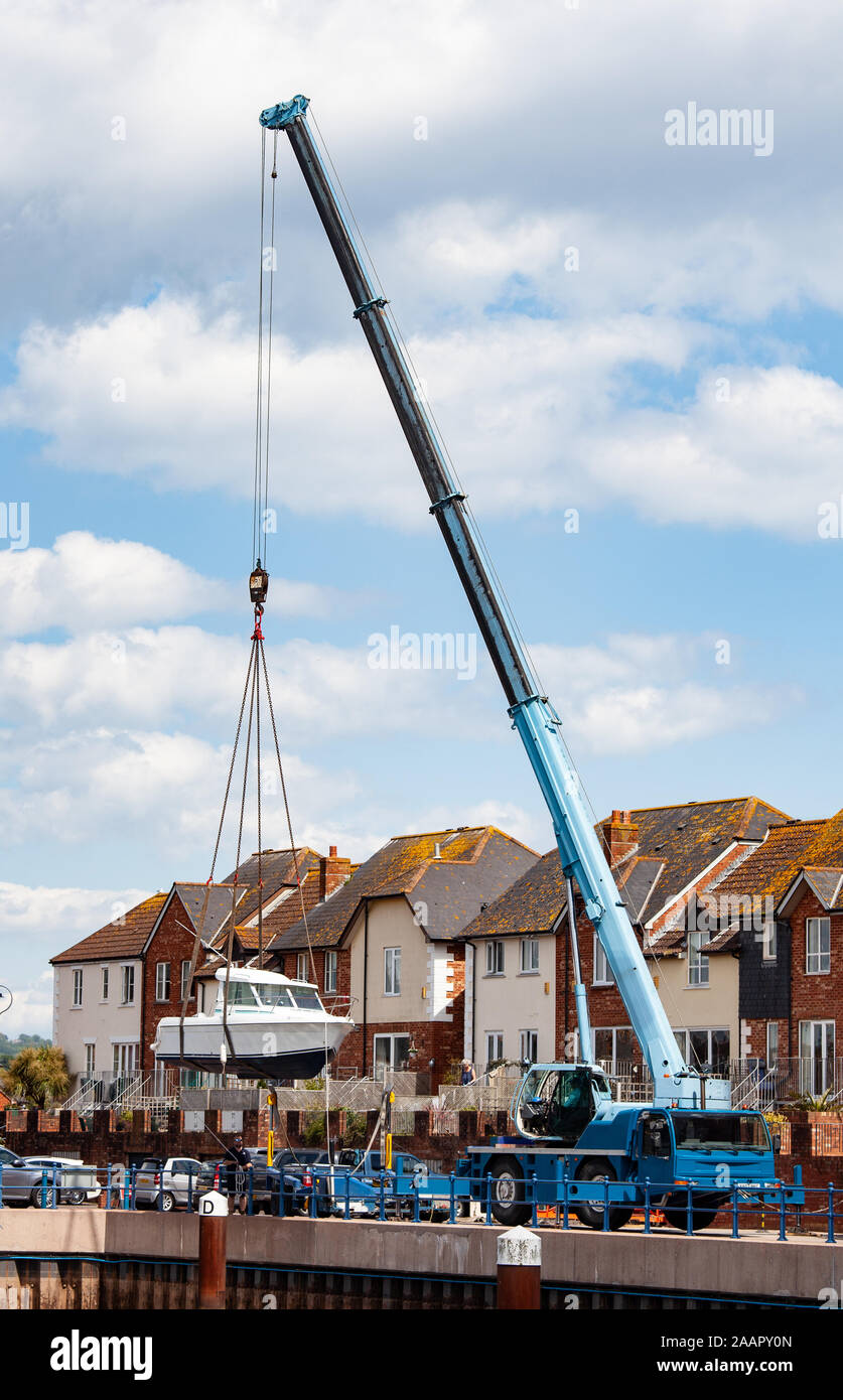 Crane lifting boat hi-res stock photography and images - Alamy