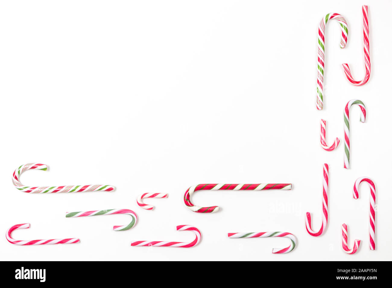 Candy canes border frame on white background. Top view, copy space ...