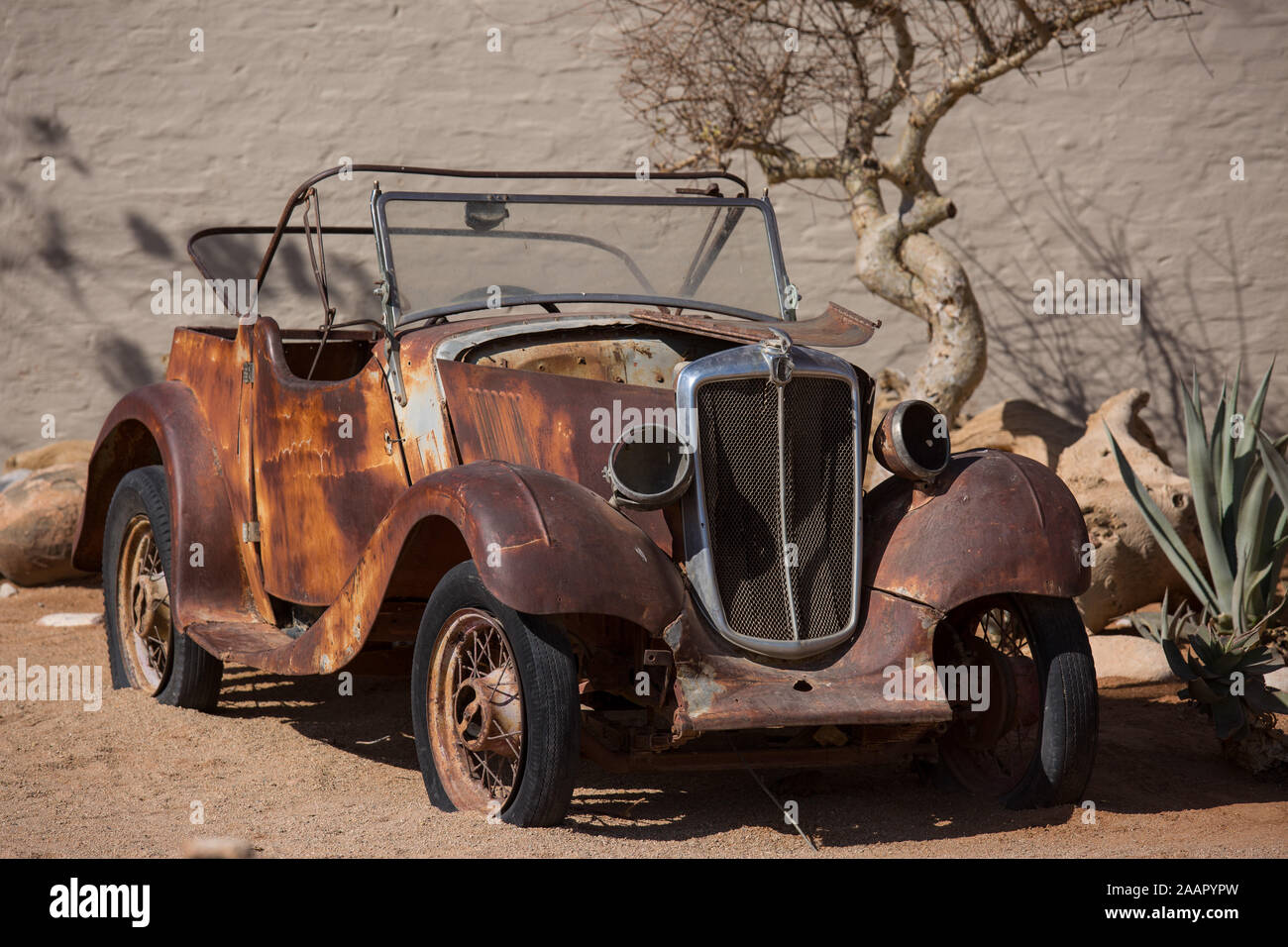 Abandoned old wrecked historic cars near a service station at Solitaire ...