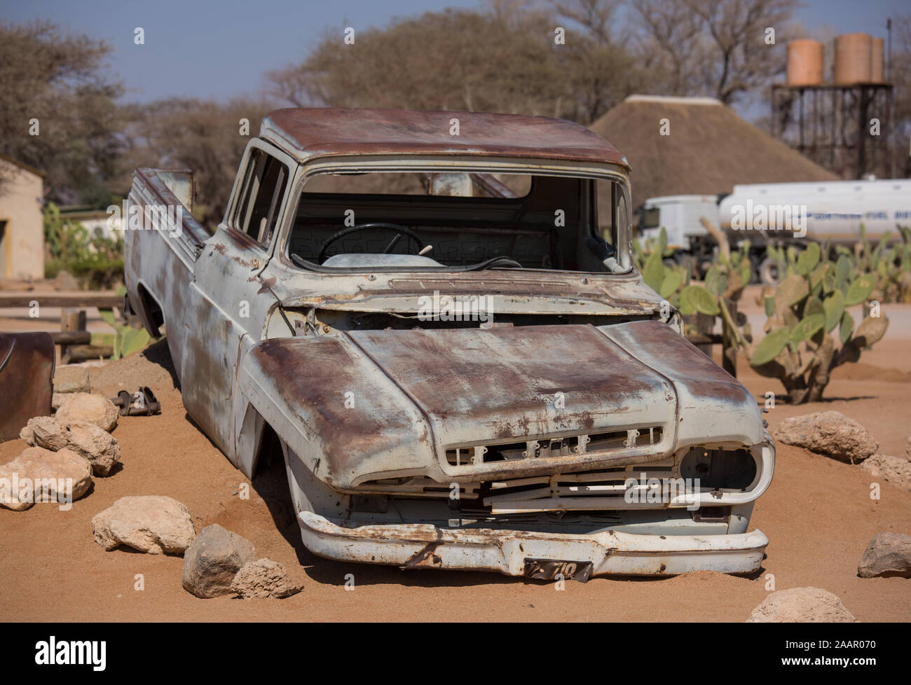 Abandoned old wrecked historic cars near a service station at Solitaire ...