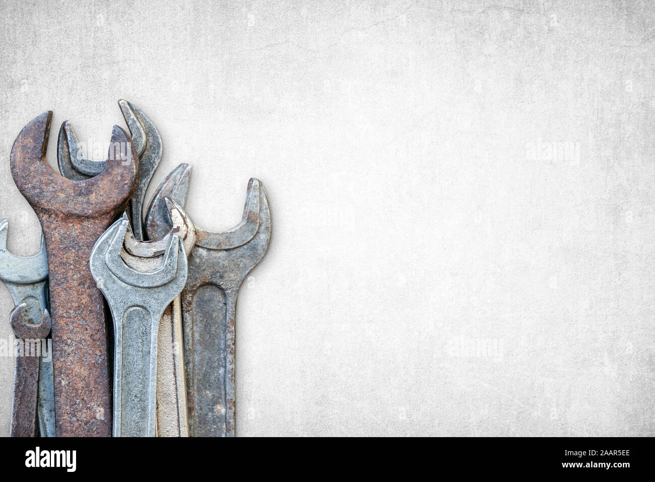 Pile of old rusty wrenches on gray background with copy space, flat lay ...