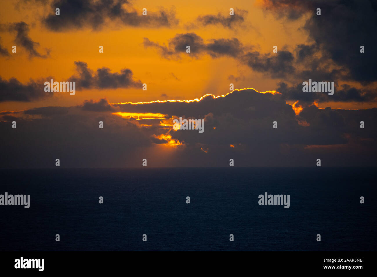 Sunrise captured off the coast of Oahu Stock Photo - Alamy