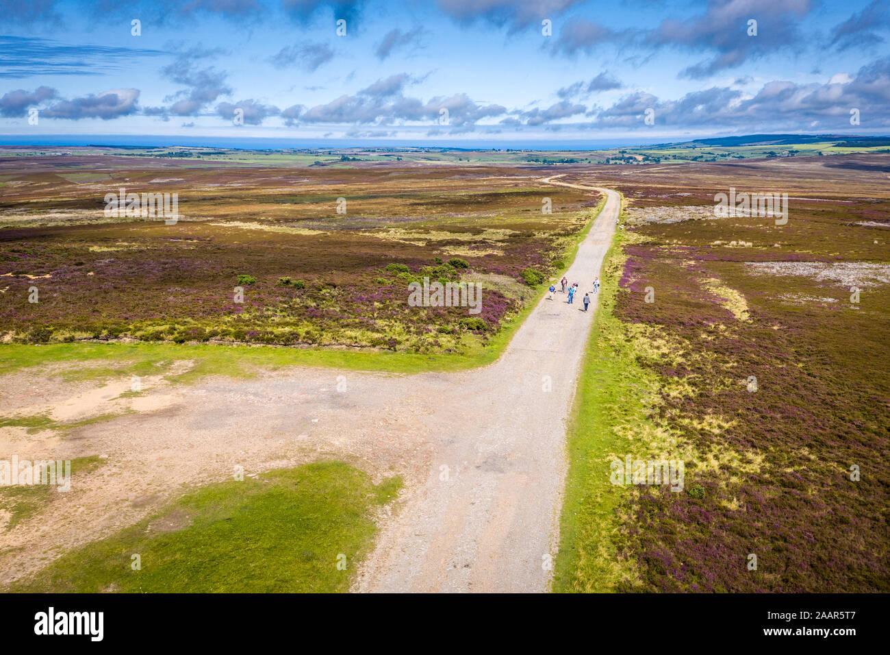 People walking throughout the sprawling countryside outside of Whitby ...