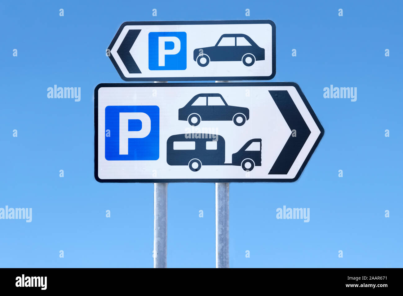Multiple car parking and caravan motorhome signs against blue sky Stock ...