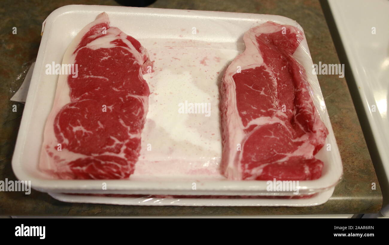 Fresh sirloin beef steak in packaging tray Stock Photo - Alamy