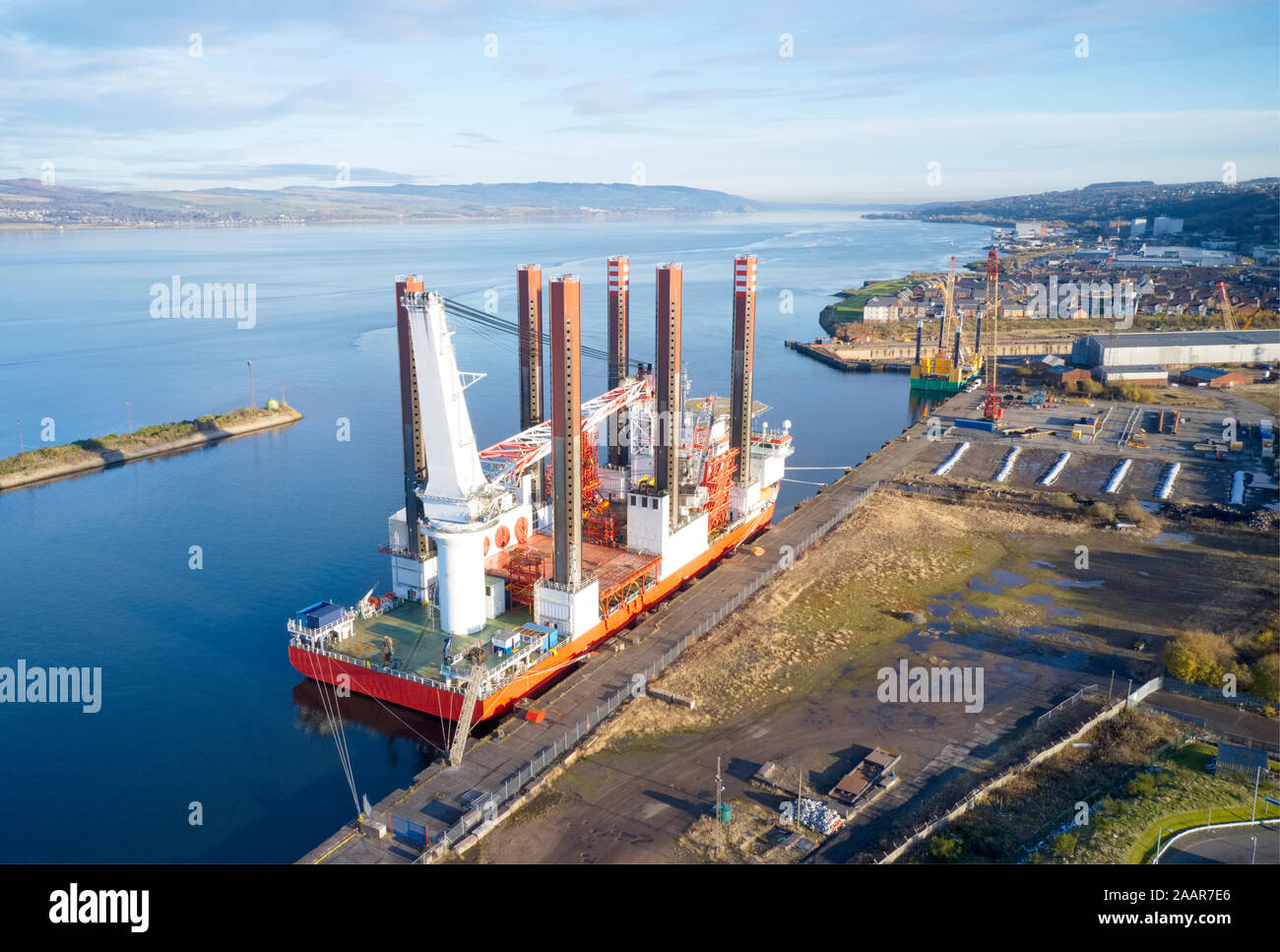 Barge ship crane construction at dock harbour in the sea ocean aerial ...