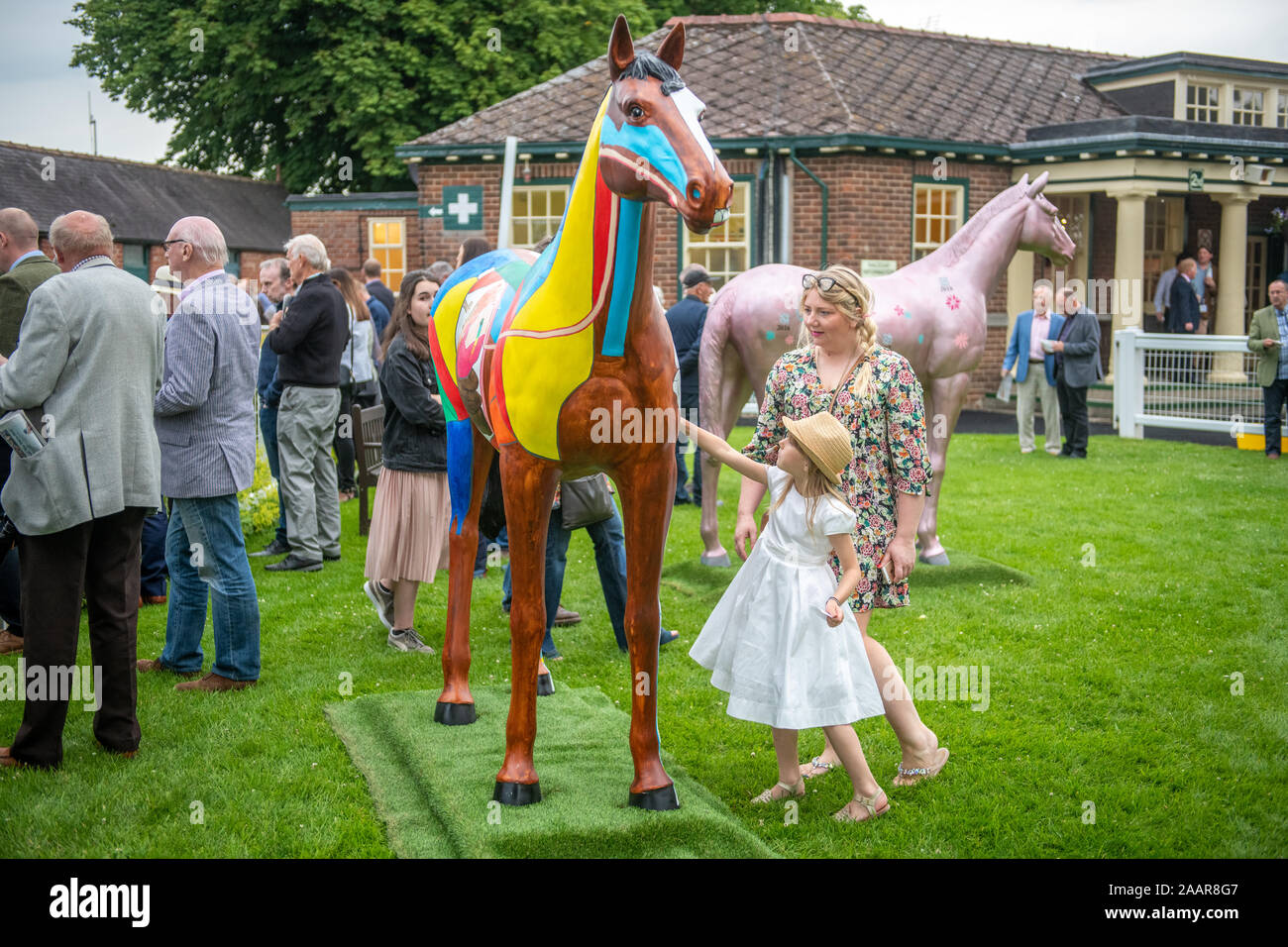A Family Curiously Observes a Statue at Ripon Races , Yorkshire UK ...