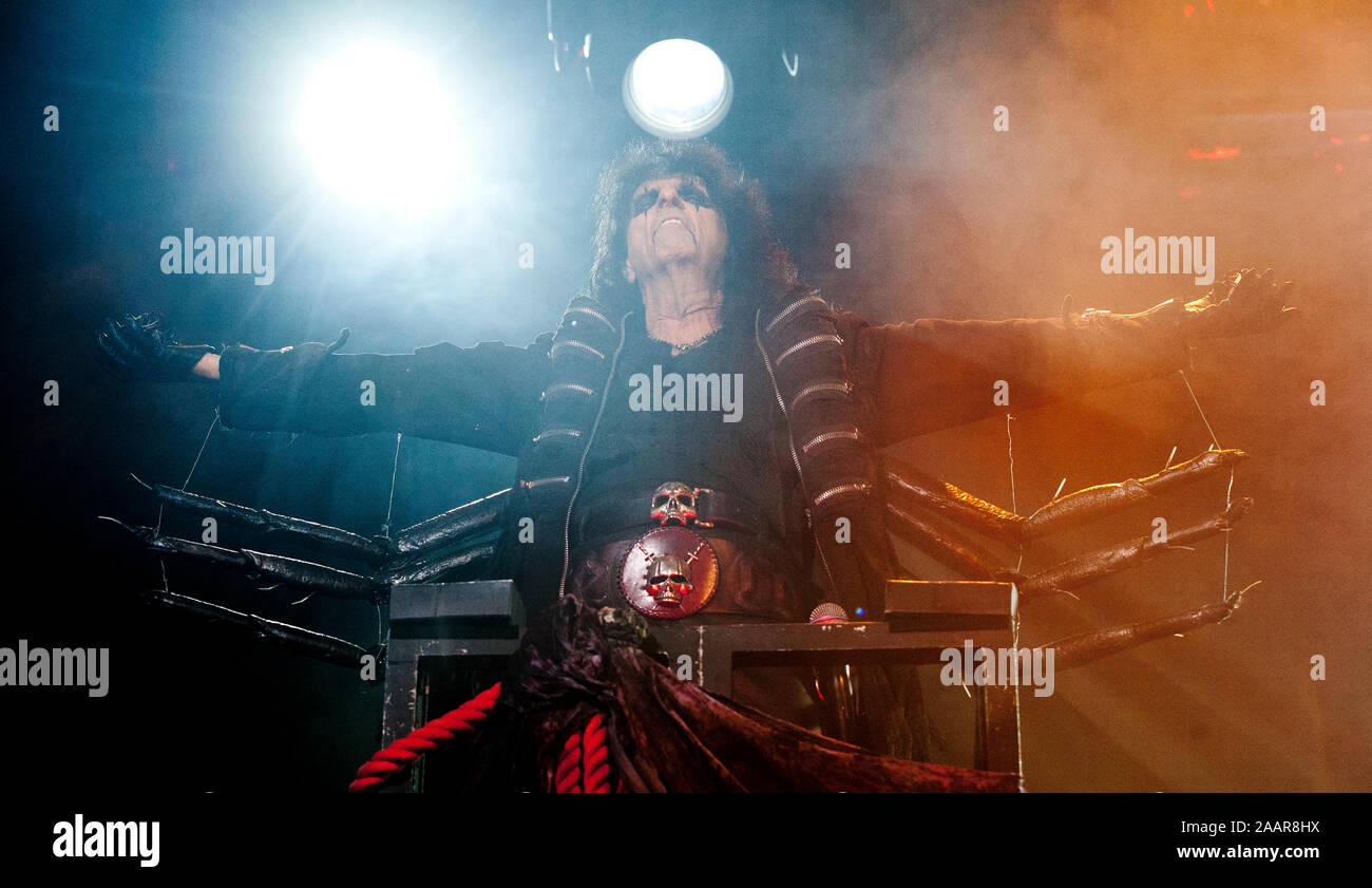Alice Cooper wearing a spider costume performing on stage in Bristol at ...