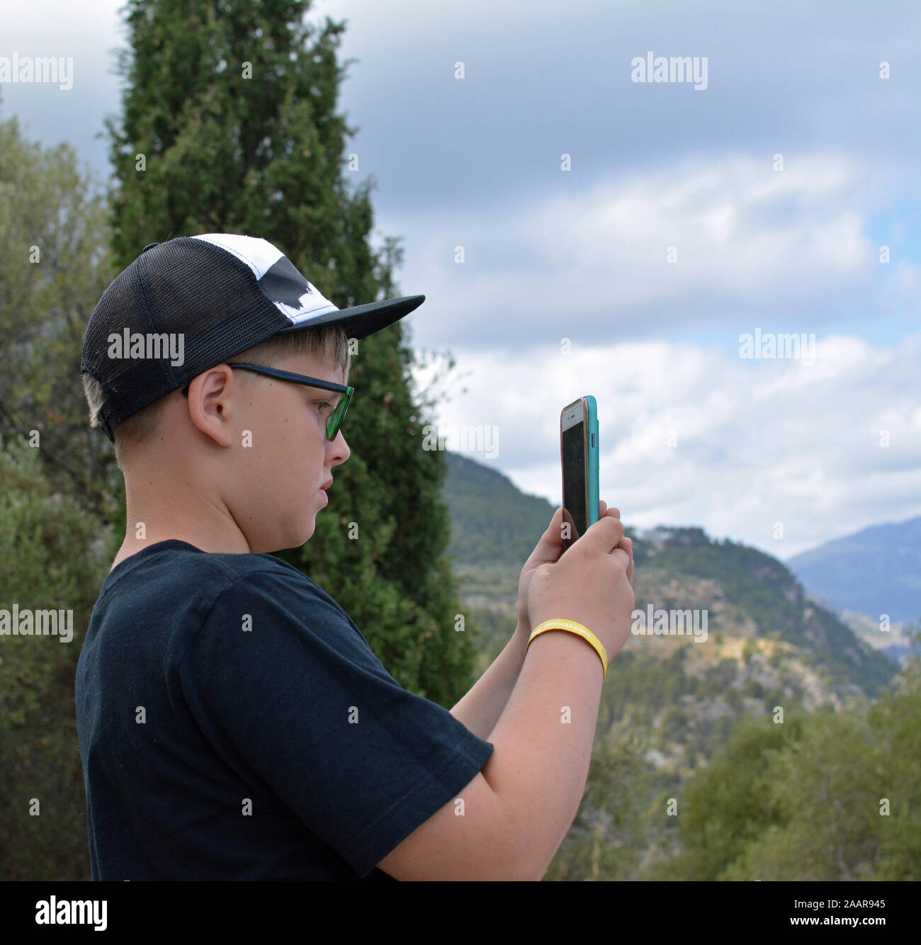 Boy taking pictures with his smartphone Stock Photo - Alamy
