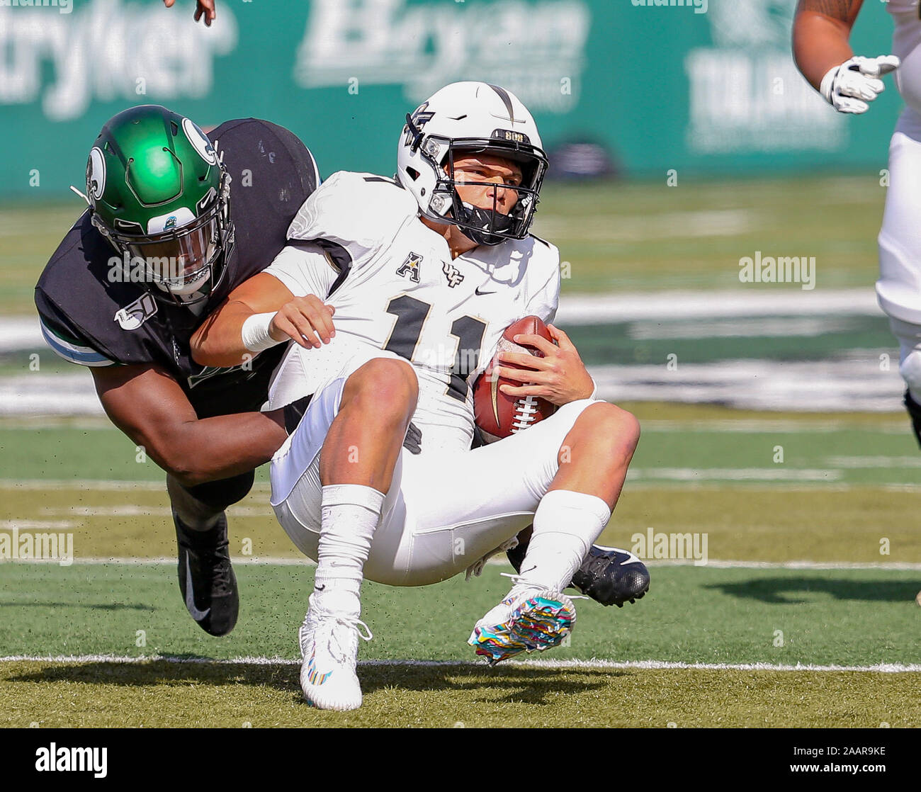 New Orleans, LA, USA. 23rd Nov, 2019. UCF'sQB Dillon Gabriel #11 is tackled from behind during a ...