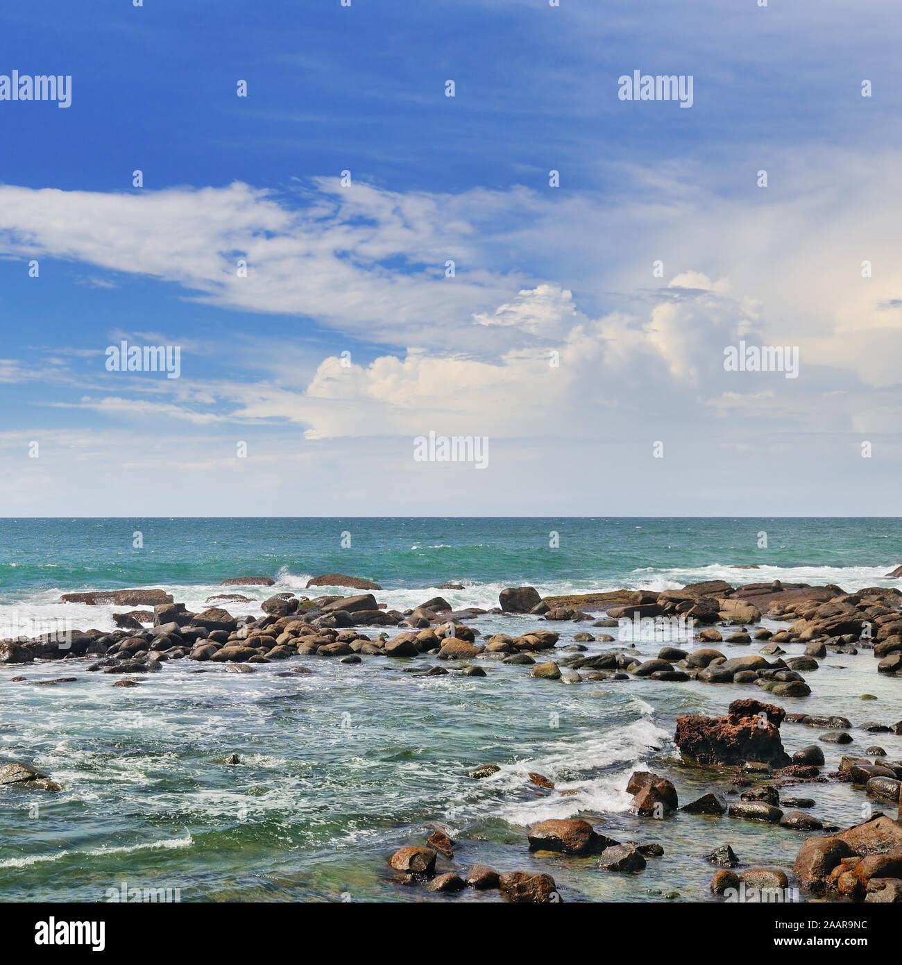 Scenic ocean, coral reef near the shore and blue sky Stock Photo - Alamy