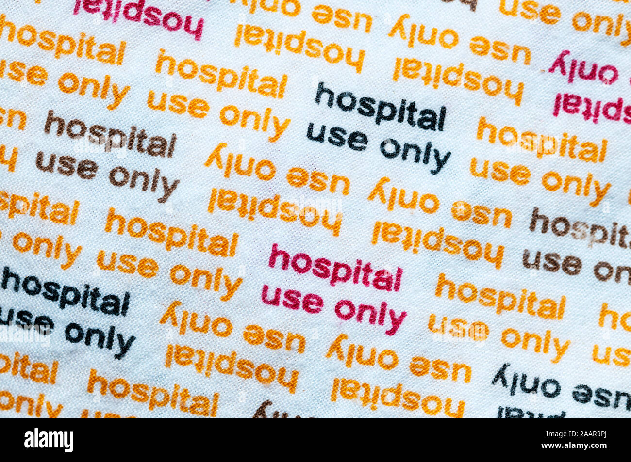 A hospital gown covered with the printed words hospital use only Stock ...