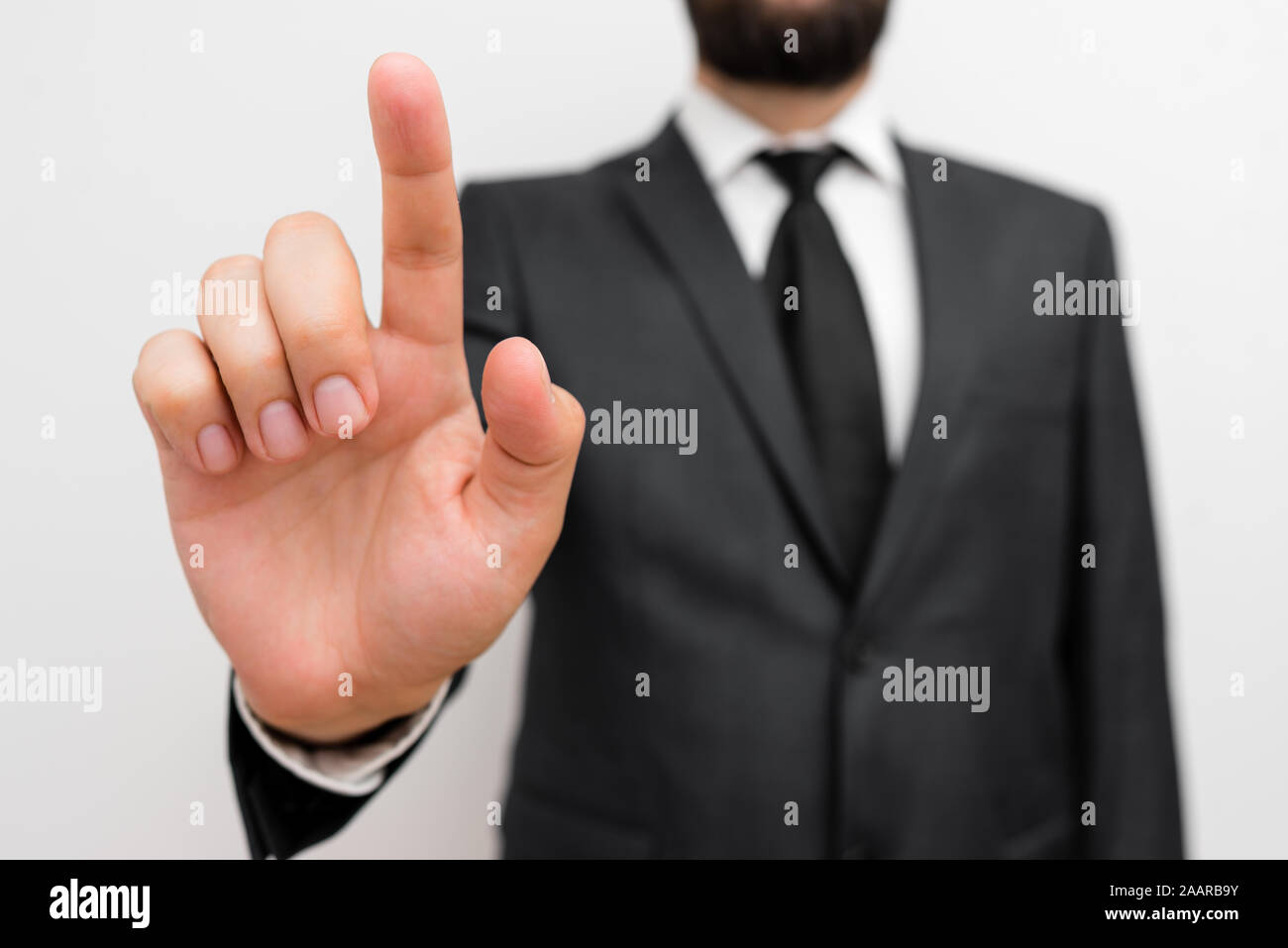 Male human with beard wear formal working suit clothes raising one hand ...