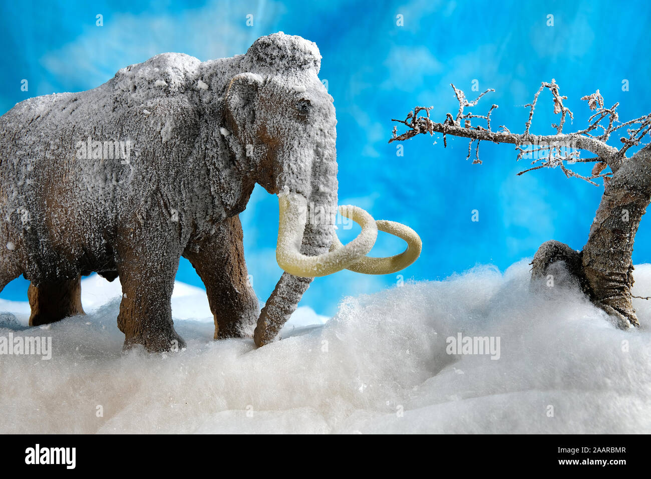 Extinct ice age mammal next to a frost covered tree Stock Photo - Alamy