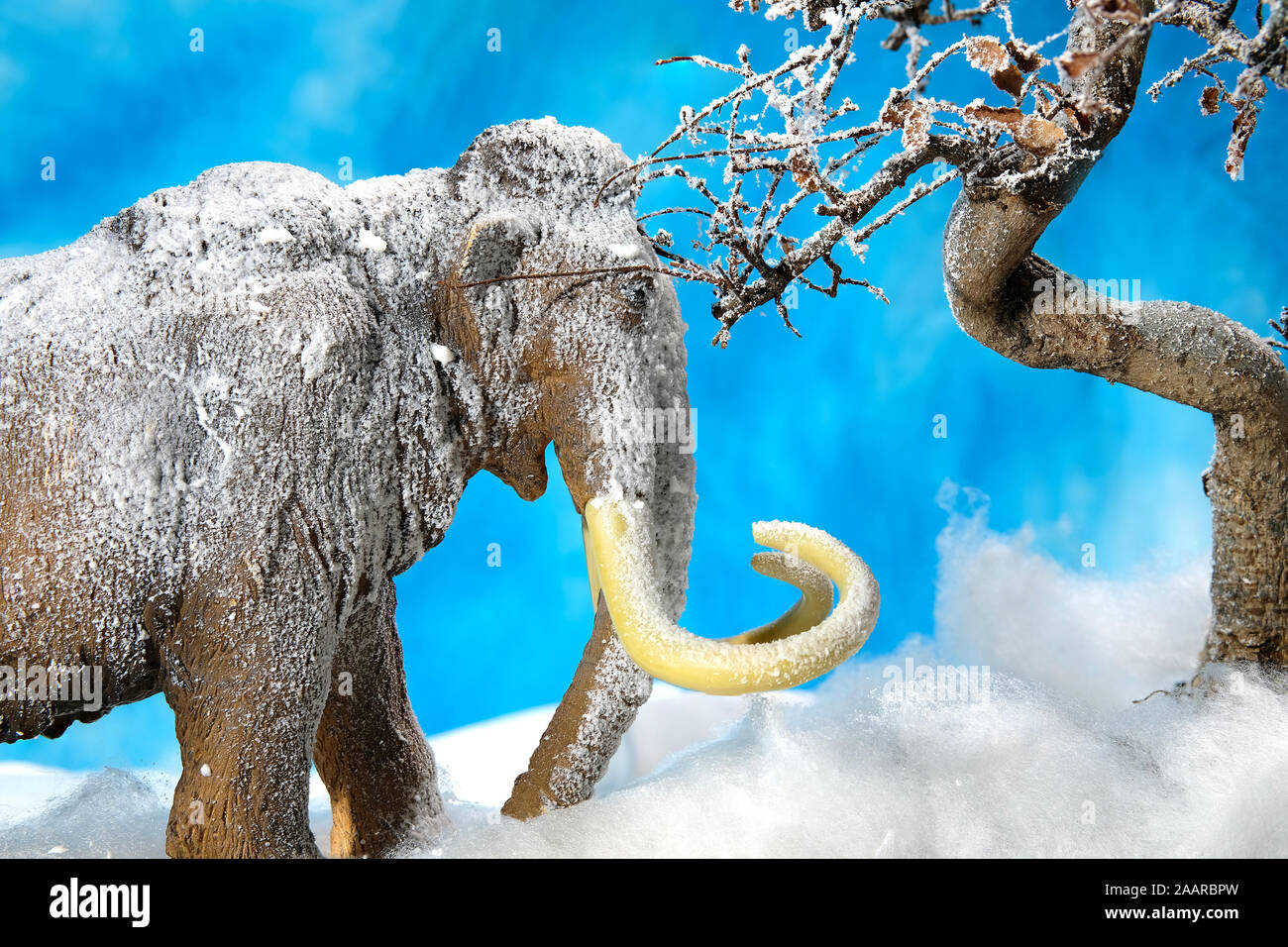 Extinct ice age mammal next to a frost covered tree Stock Photo - Alamy