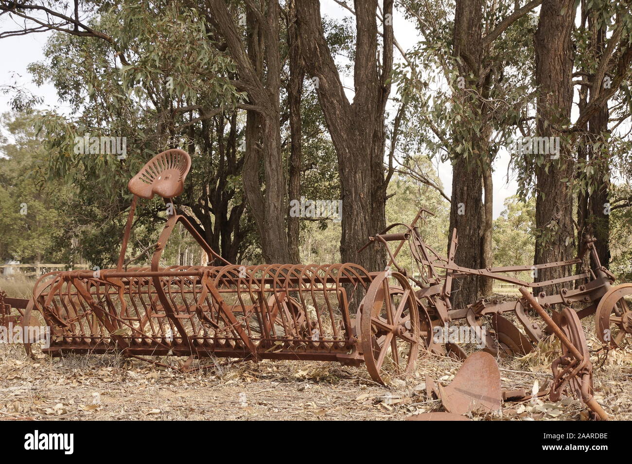 Overgrown old farm equipment hi-res stock photography and images - Alamy