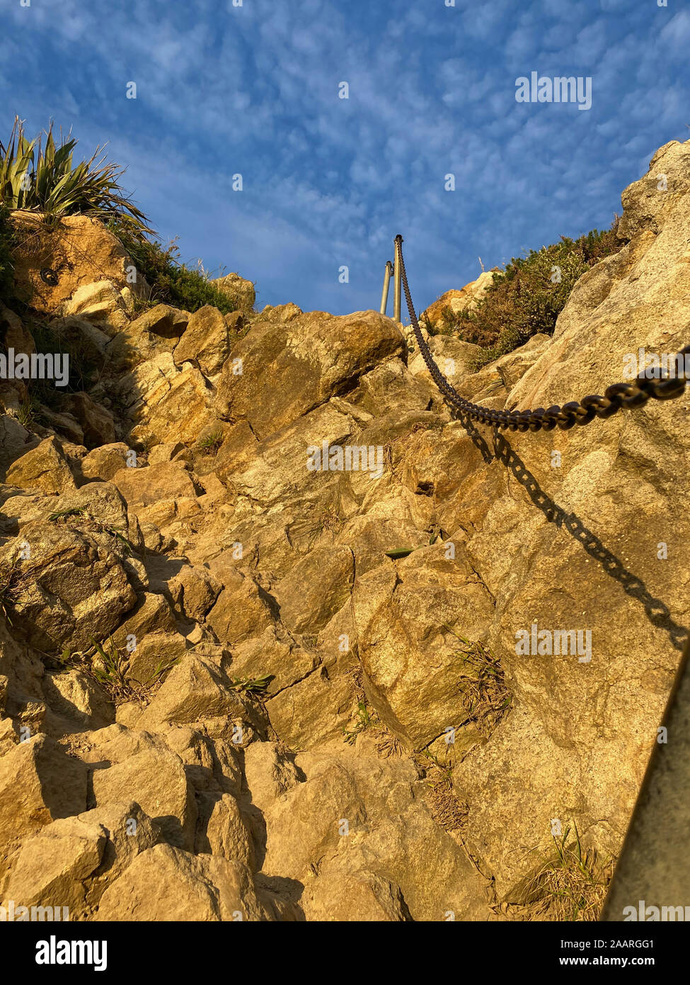 Chain going up a steep section of Paritutu Rock, New Plymouth Stock ...