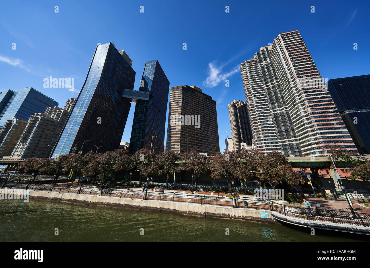 view of the massive midtown buildings in Manhattan from street level ...