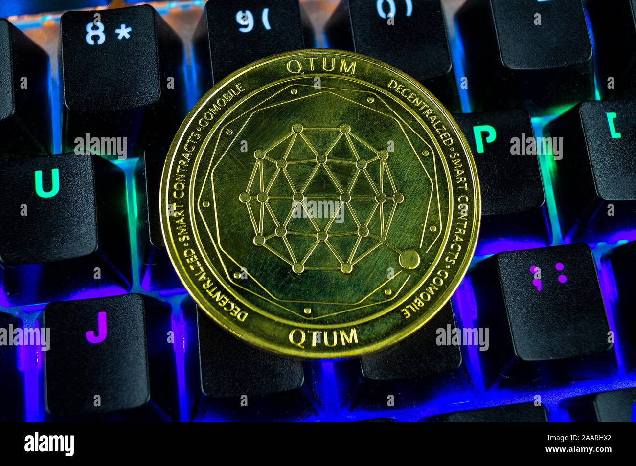 Coin cryptocurrency qtum close-up of the colour-coded keyboard ...